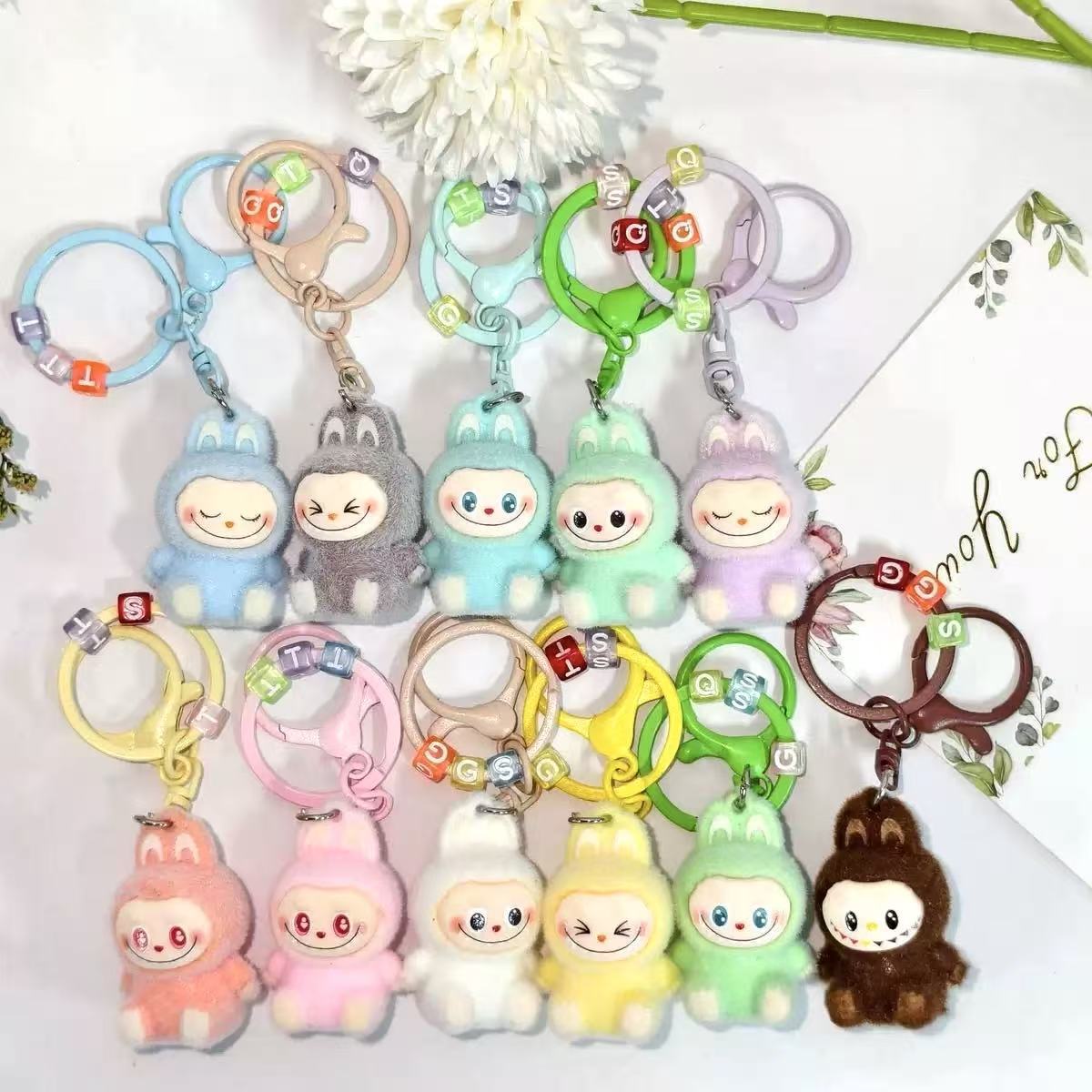 Wholesale flocked cute key doll keychain — JOYASDECHINA WHOLESALE JEWELRY